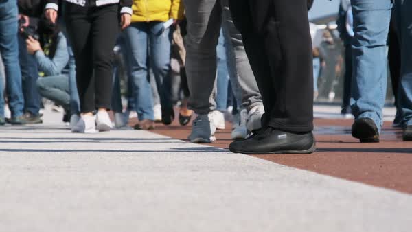 Legs of Crowd People Walking on the Street, Close-up of People feet ...
