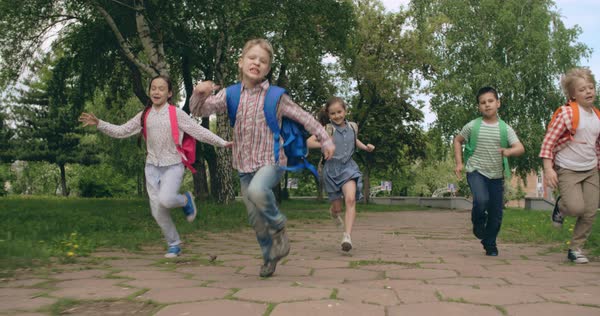 Active school children running towards camera - Stock Video Footage ...