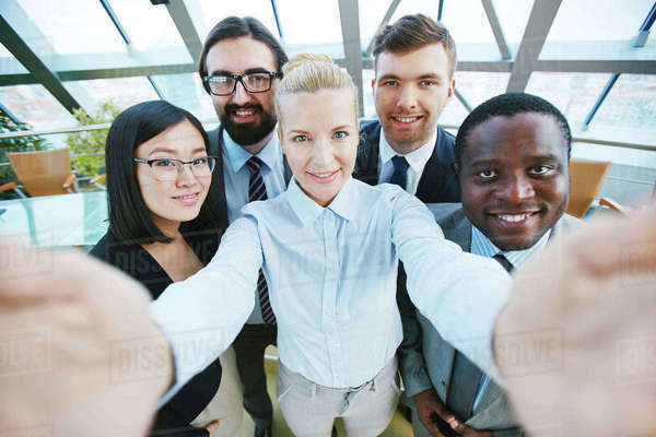 Group of happy employees taking selfie - Royalty-free Stock Photo ...