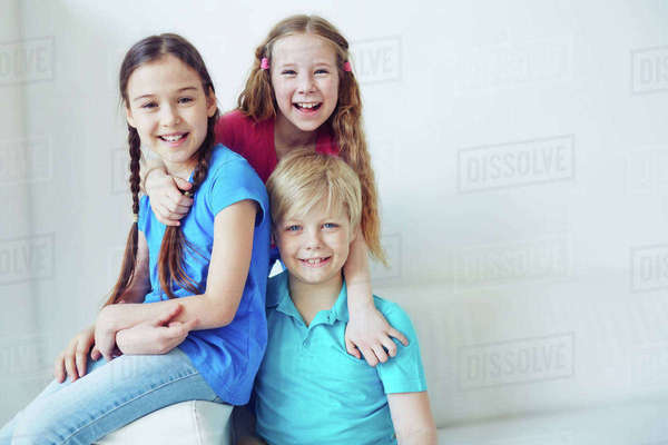 Happy little friends in casual-wear looking at camera - Royalty-free ...