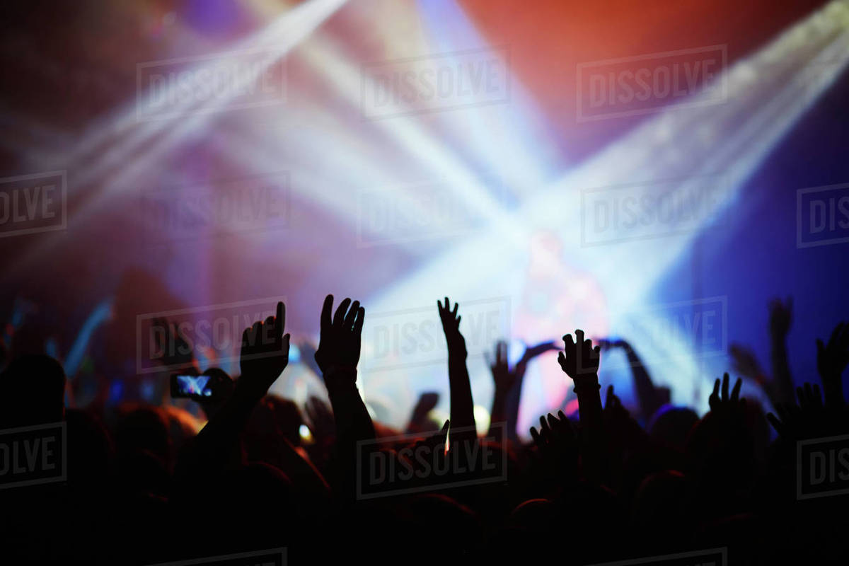 People with hands up having fun at concert - Royalty-free Stock Photo ...