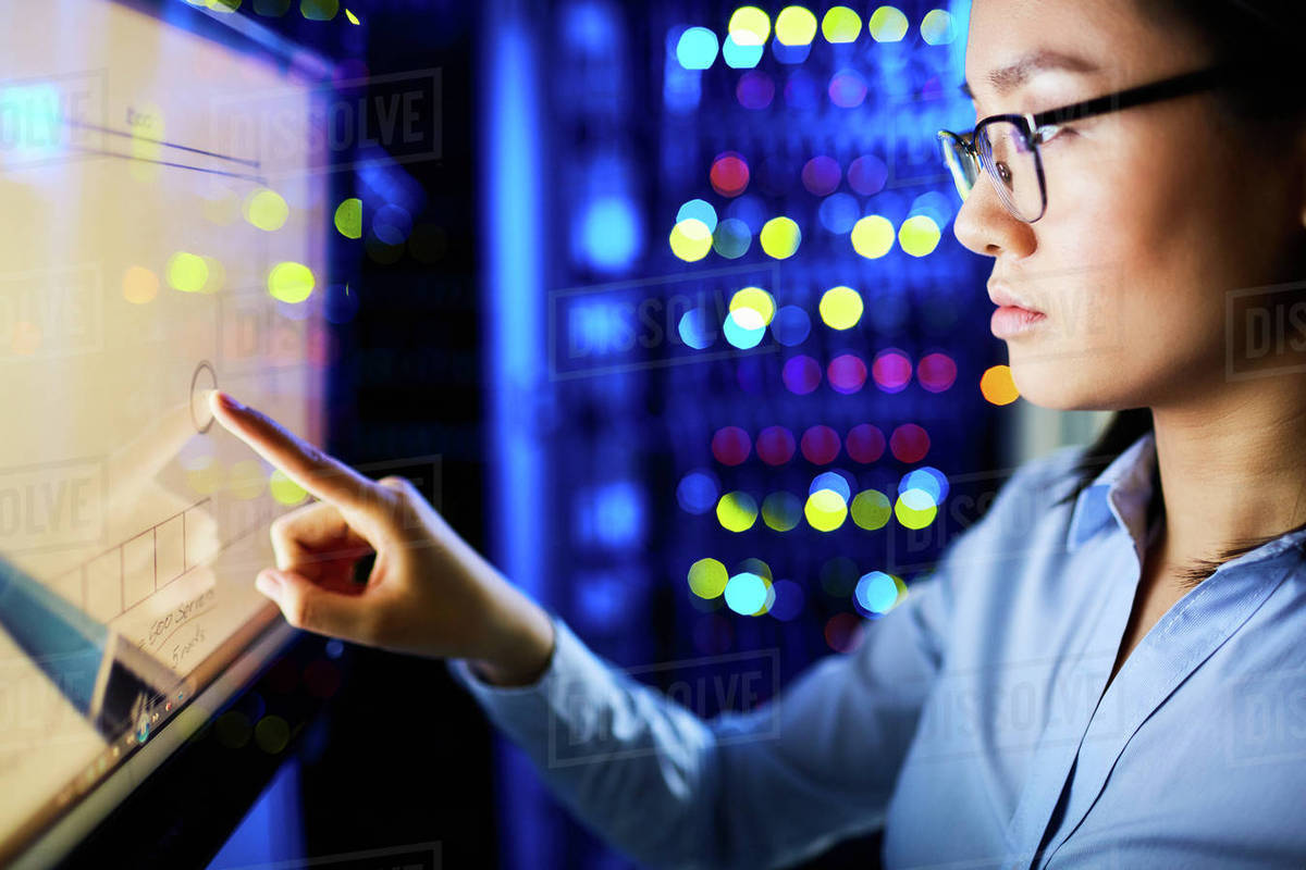 Modern engineer touching screen of computer - Stock Photo - Dissolve