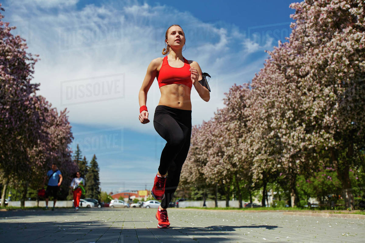 Pretty runner jogging outdoors in the morning - Royalty-free Stock ...