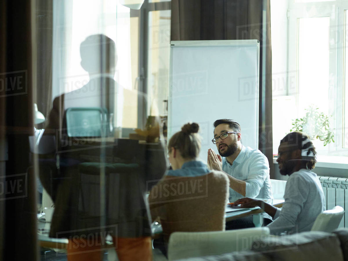 Modern businessman explaining his view point to colleagues - Stock ...