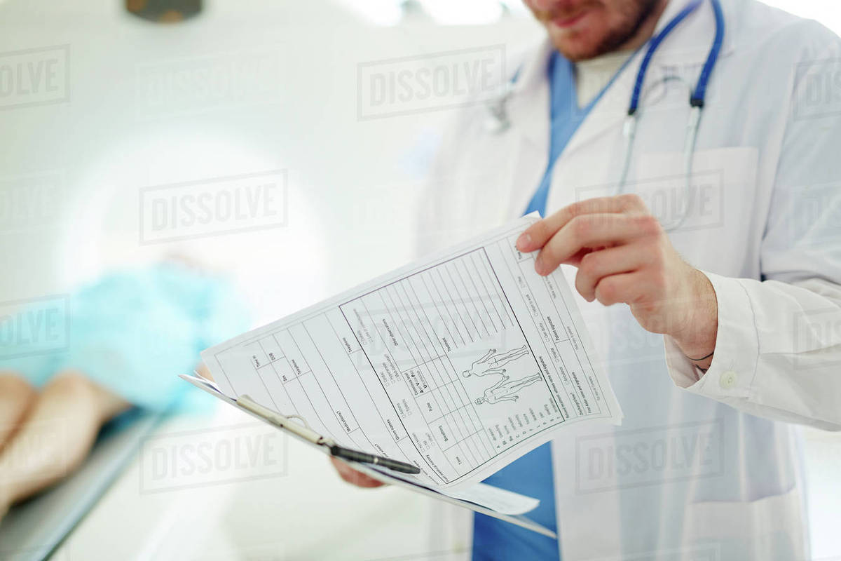 Doctor watching medical record of a patient - Royalty-free Stock Photo ...