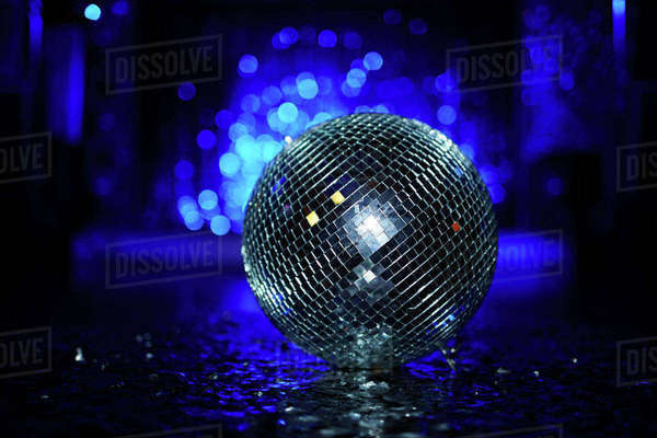 Close-up of a disco ball on dance floor - Stock Photo - Dissolve