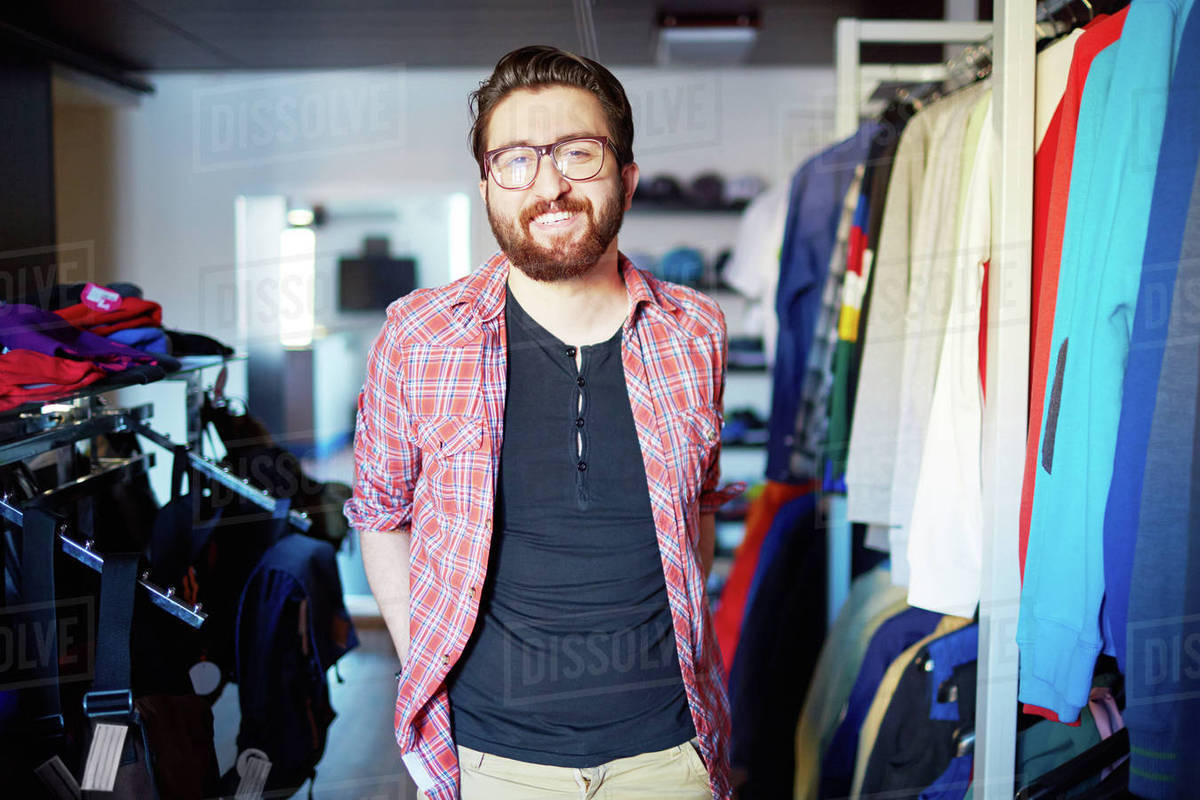 Portrait of male sales assistant in clothing store - Royalty-free Stock ...