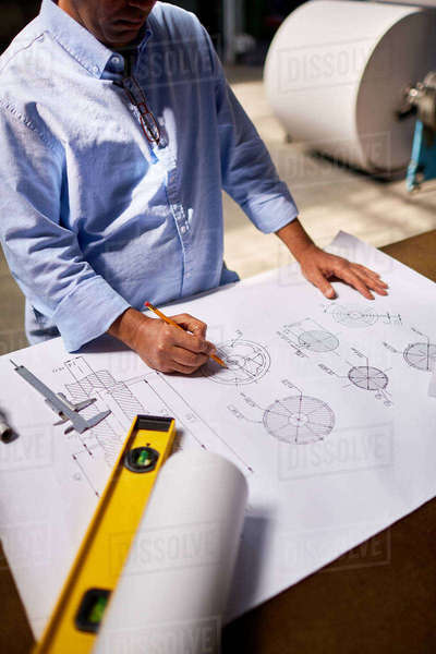 Engineer drawing technical details - Royalty-free Stock Photo | Dissolve