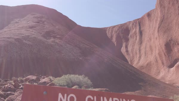 Uluru Base Walk no climbing sign in path of Uluru-Kata Tjuta National ...
