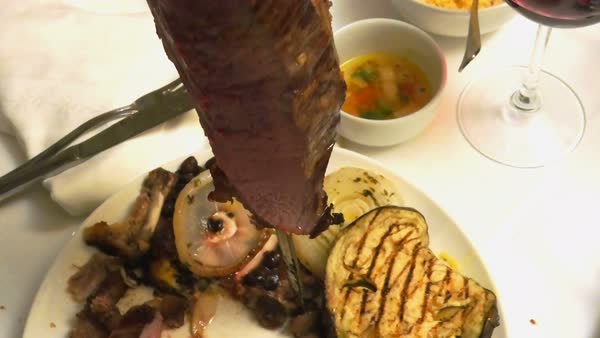 Close up of a picanha roast beef cut on the sword in Brazilian ...