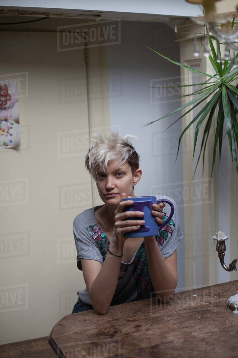 Young woman hanging out in her apartment - Royalty-free Stock Photo ...