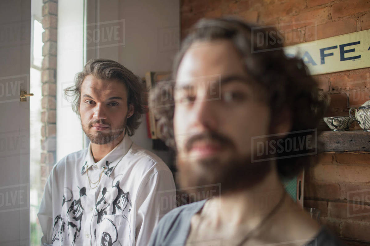 Portrait of a young man with his boyfriend in the foreground - Royalty ...