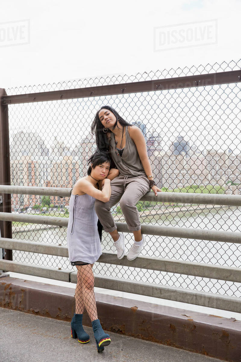 Young women posing on a bridge - Royalty-free Stock Photo | Dissolve