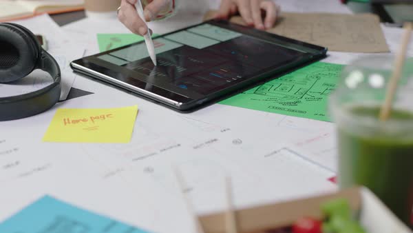 Close up hands engineers developing software app using digital tablet ...