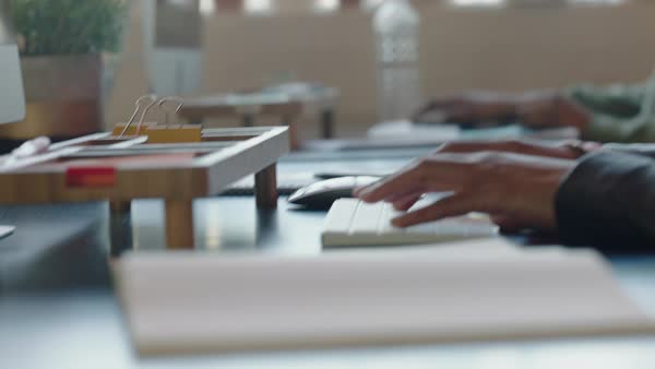 Close up hands typing on keyboard professional business people using ...