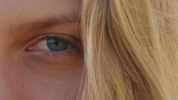 Close up beautiful blue eye opening looking contemplative - 4K Royalty ...