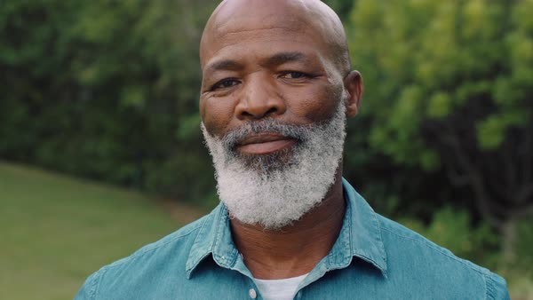 Portrait old african american man looking happy in park enjoying ...