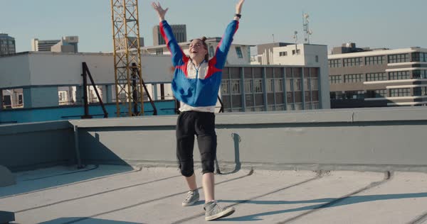 Funny woman dancing on rooftop celebrating enjoying silly dance having ...
