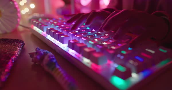 Teenage girl hands typing on keyboard gamer girl playing online game ...