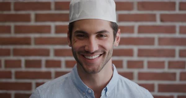 Portrait of attractive young muslim man smiling and enjoying successful ...