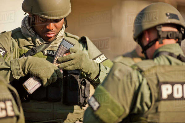 Two police officers at a training facility. - Stock Photo - Dissolve