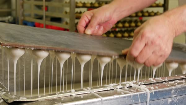 Making Bonbons chocolate candy in a bakery factory - Stock Video ...