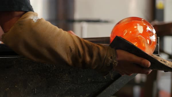 Glassworks glass manufacturing, process of forming a decorative peace ...