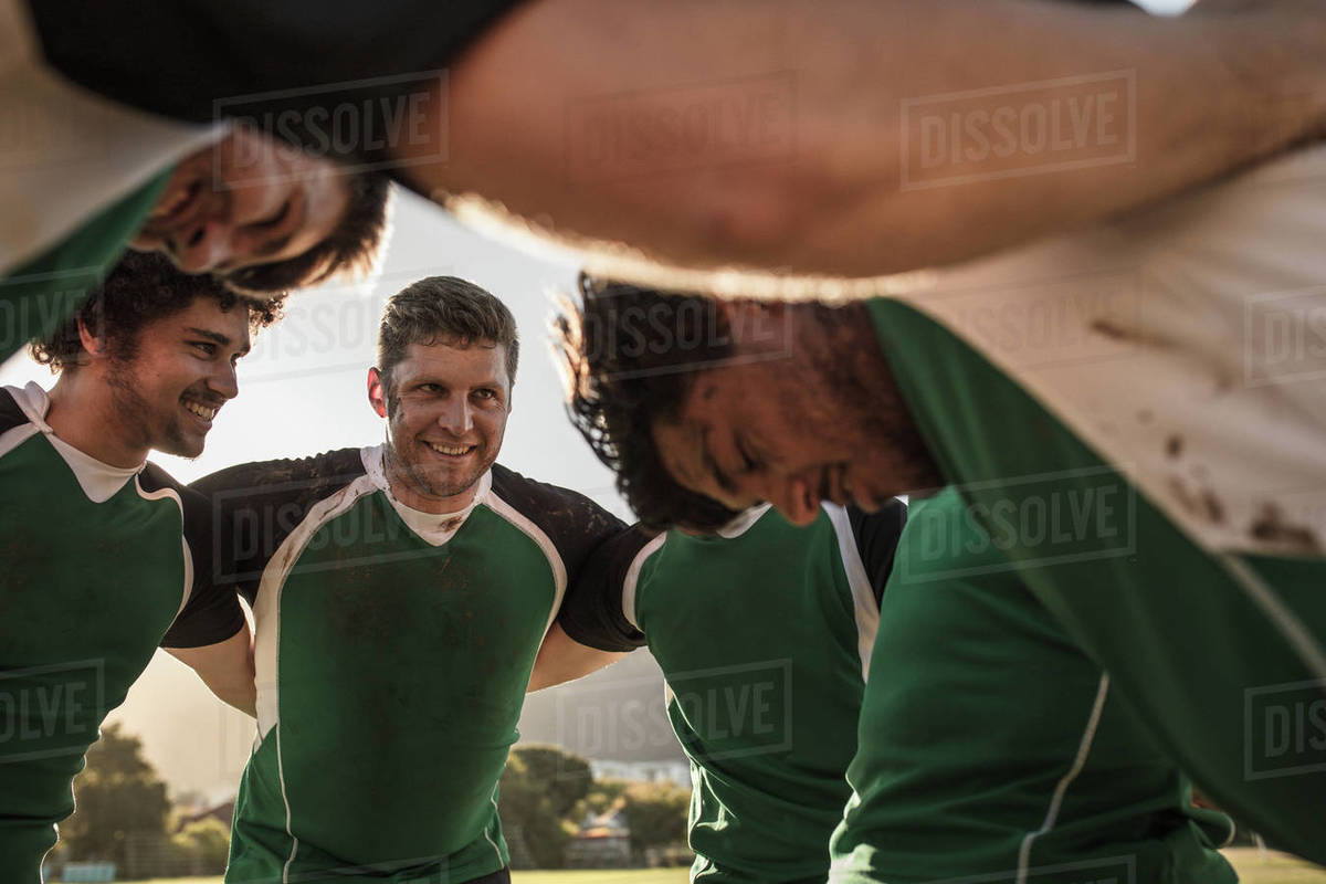 Group of rugby players standing in circle. Professional rugby players ...