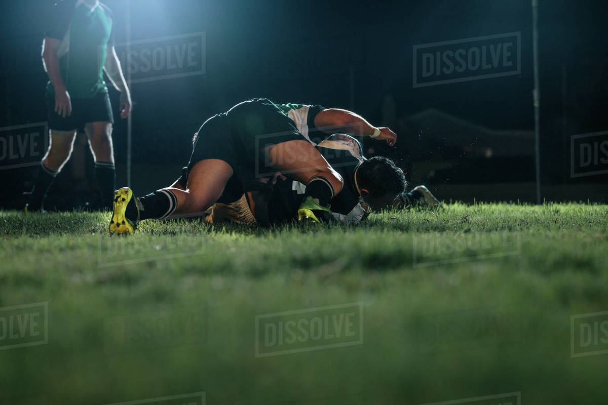Strong rugby players fighting for ball during game at stadium. Rugby ...
