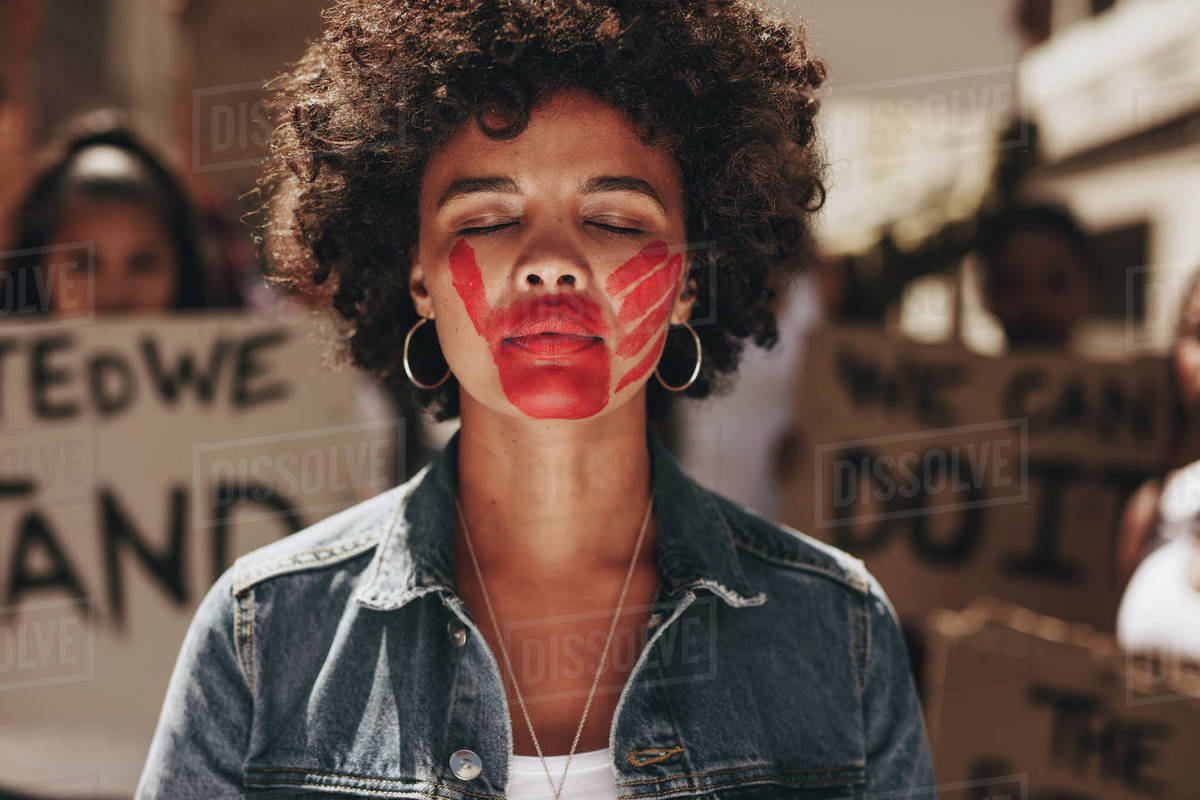 Woman with a hand print on her mouth, demonstrating violence on women ...