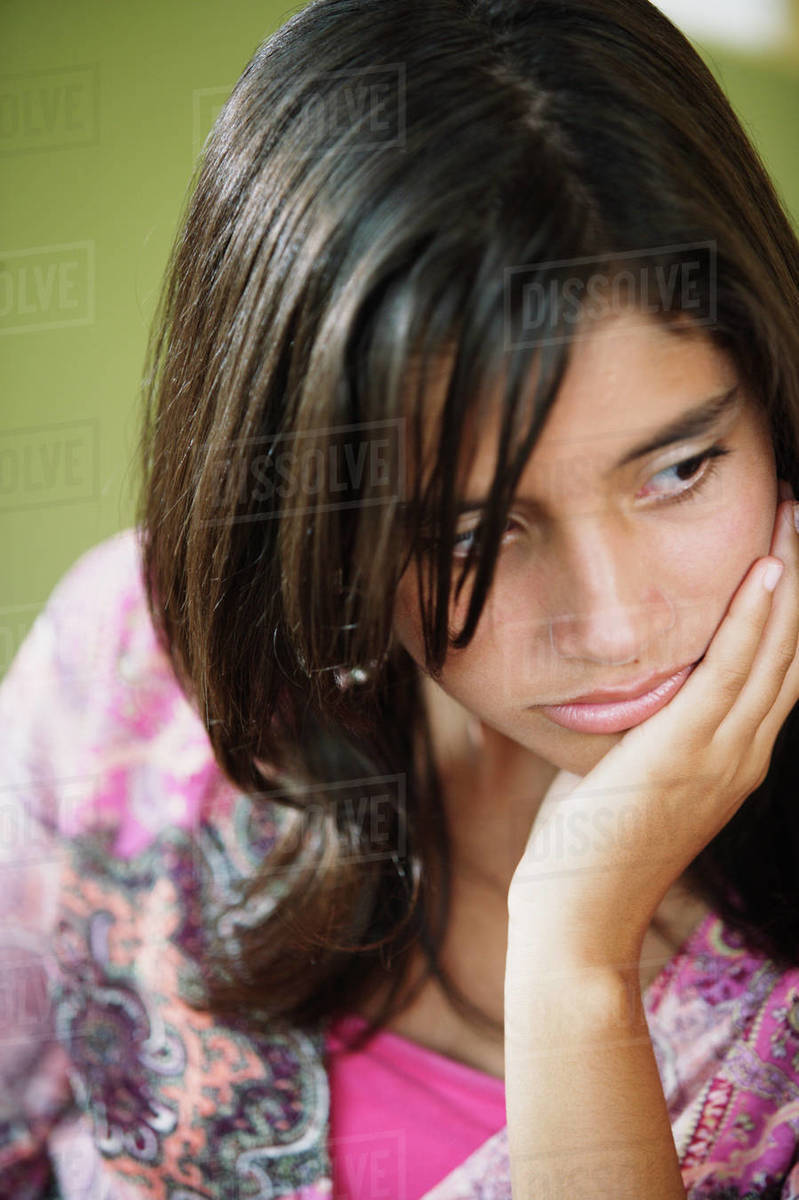 Teenage girl thinking - Stock Photo - Dissolve