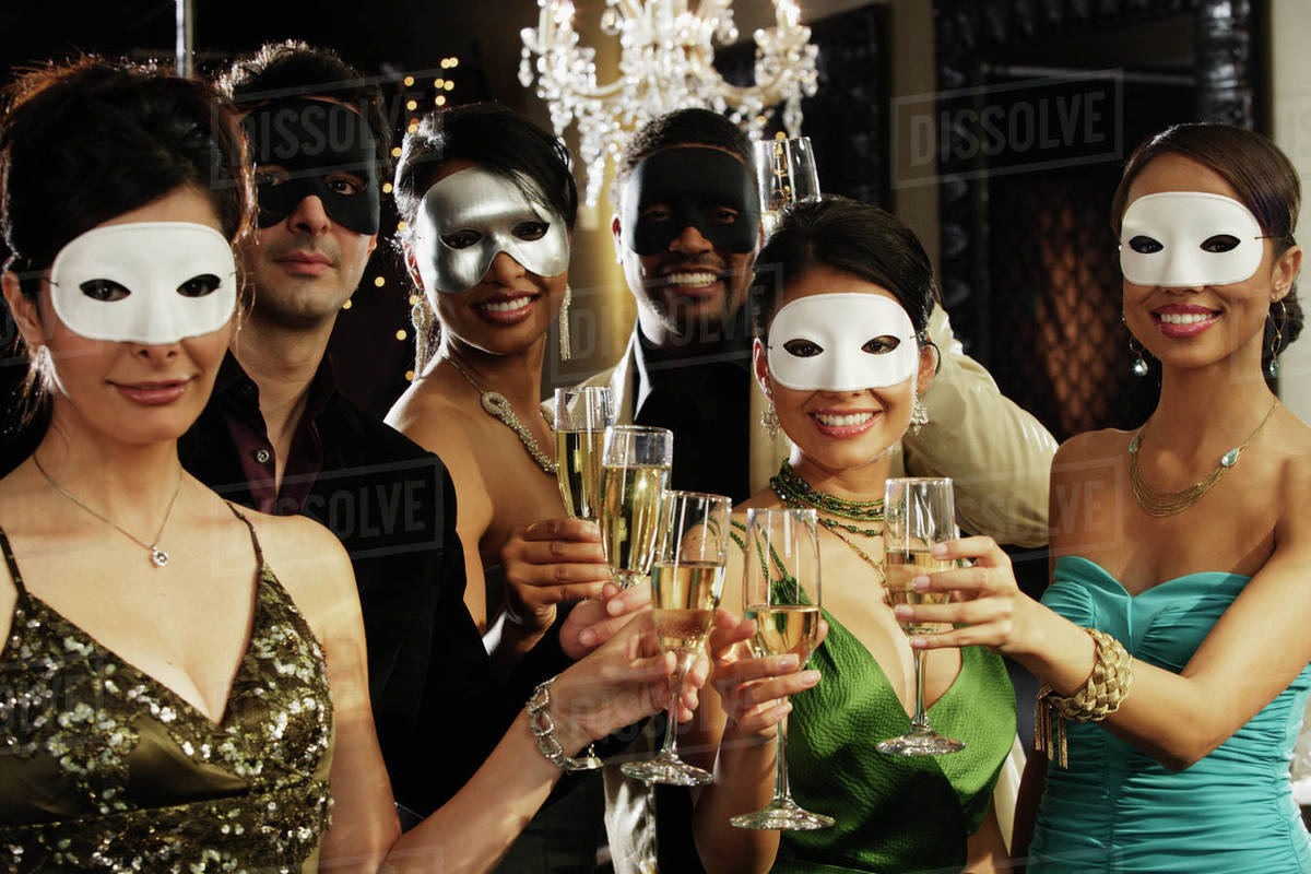 Portrait of multi-ethnic friends at masquerade party - Stock Photo ...