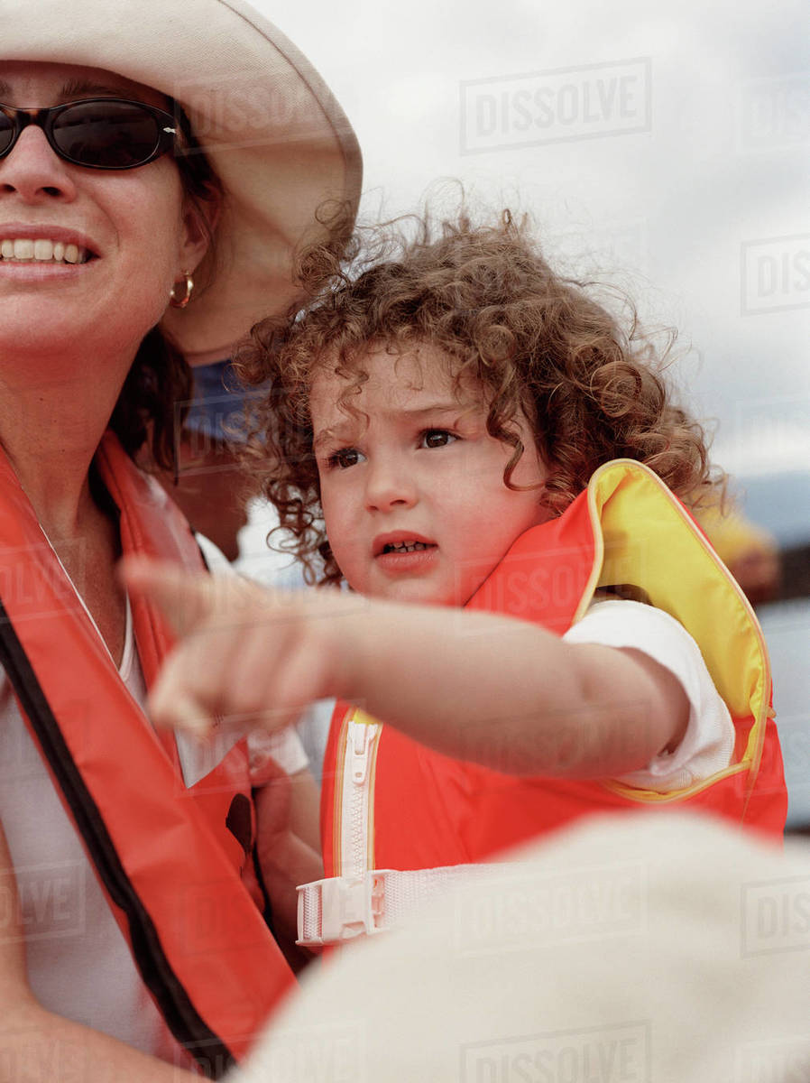 Mother and young daughter wearing life-jackets - Royalty-free Stock ...