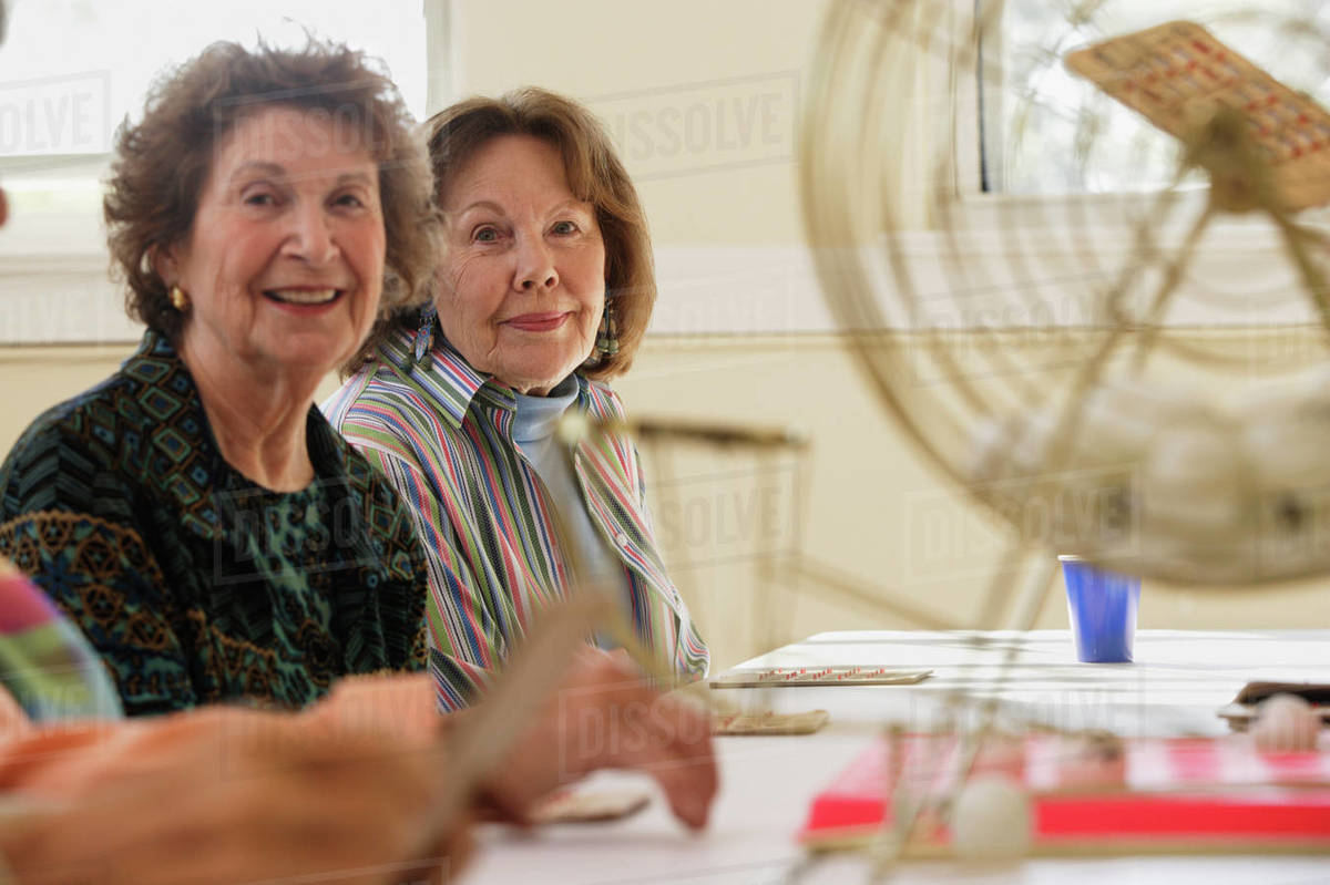 Elderly women playing bingo - Stock Photo - Dissolve