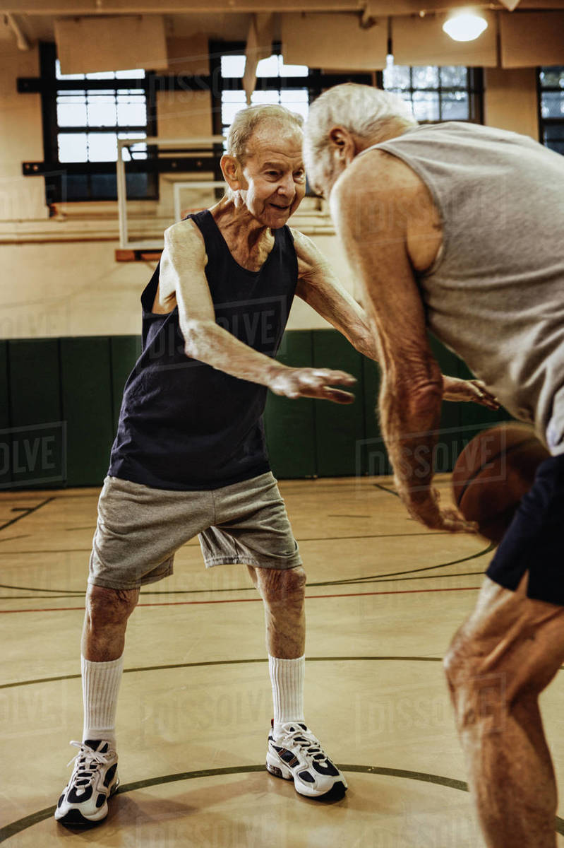 Elderly men playing basketball - Royalty-free Stock Photo | Dissolve