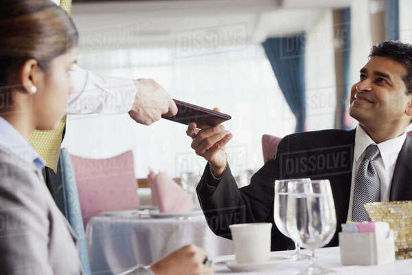 Businessman paying the check at restaurant - Royalty-free Stock Photo ...