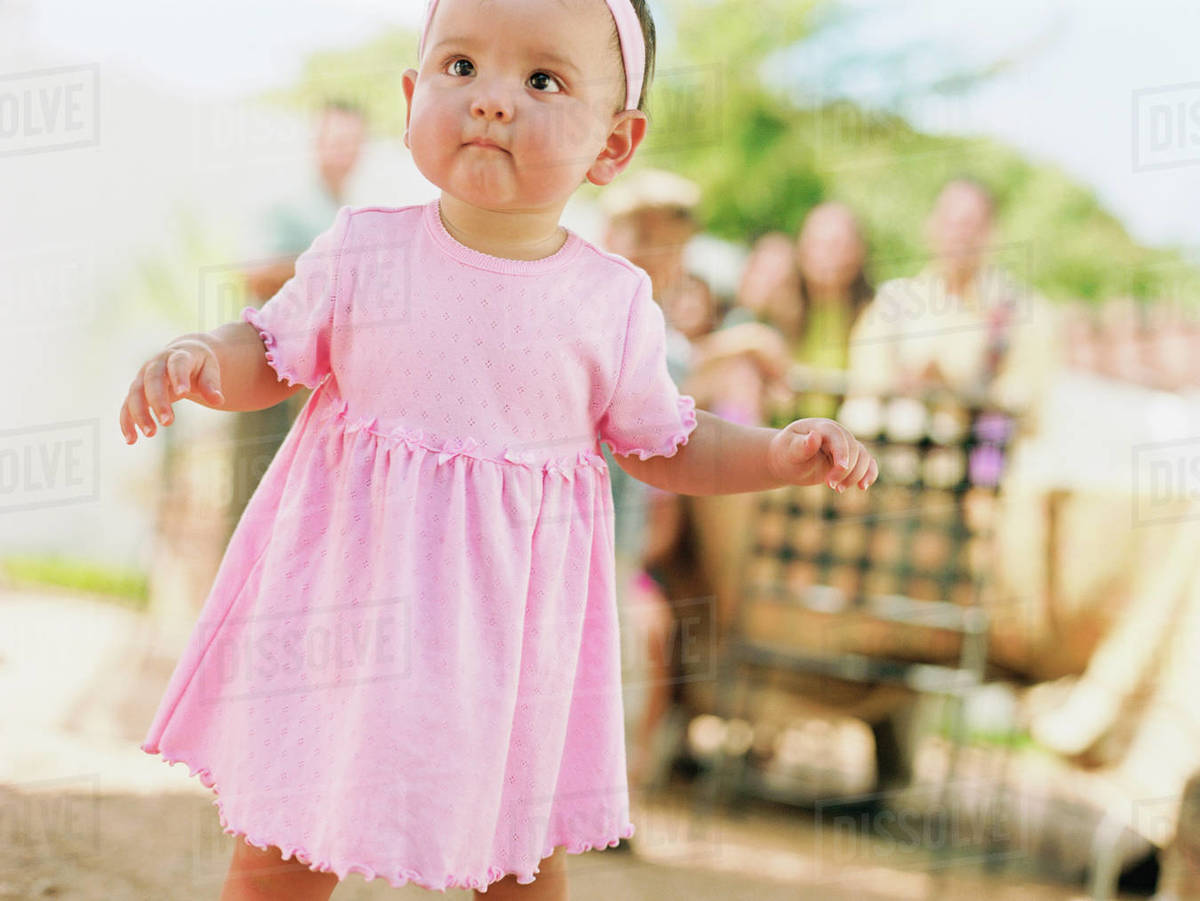 Toddler girl walking - Royalty-free Stock Photo | Dissolve