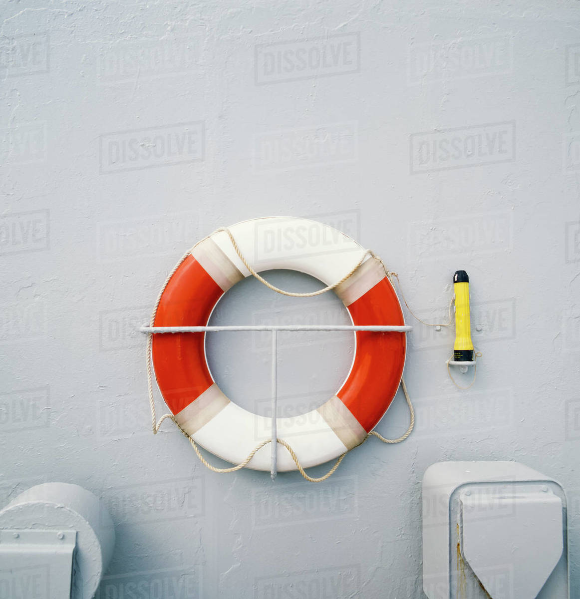 Close up of red and white life preserver ring hanging on side of ship ...