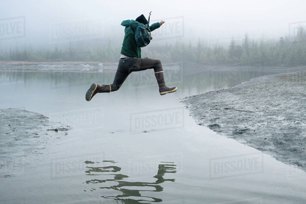Jumping over a gap at the Mendenhall Lake - Royalty-free Stock Photo ...