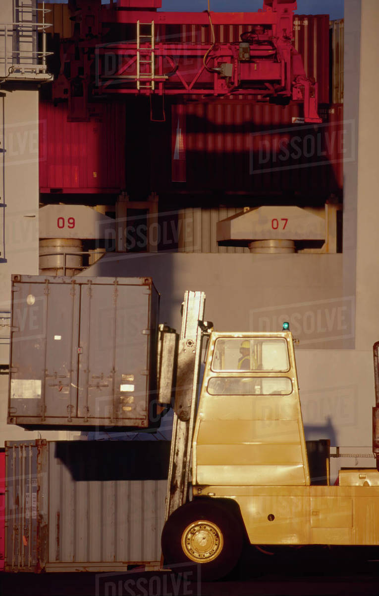 Forklift working with shipping containers at the port - Royalty-free ...