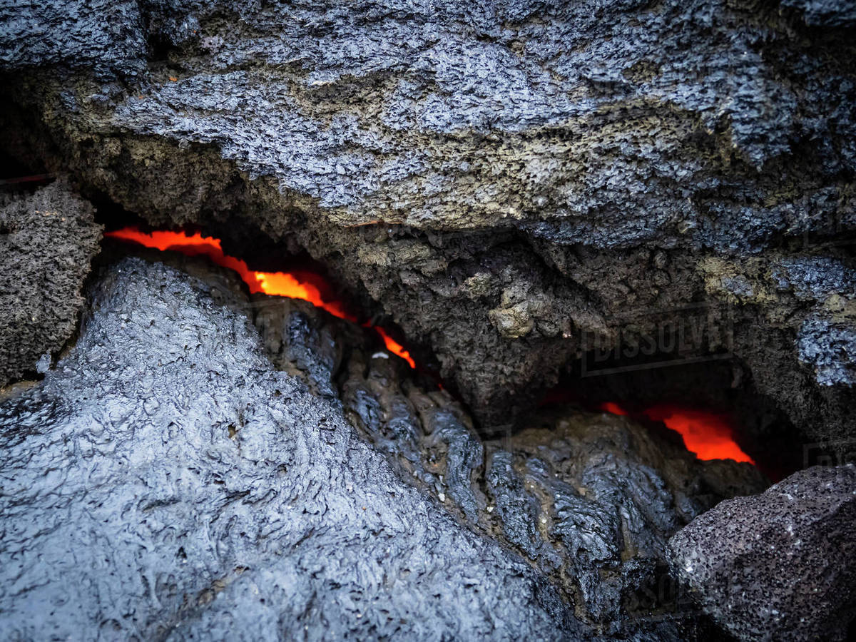 Hot magma visible underneath cooled lava crust, Fagradalsfjall volcano ...