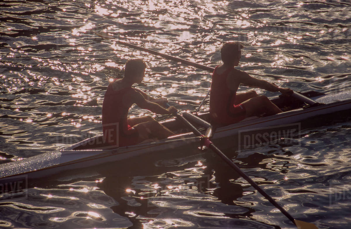 Two men rowing in double scull on water - Royalty-free Stock Photo ...