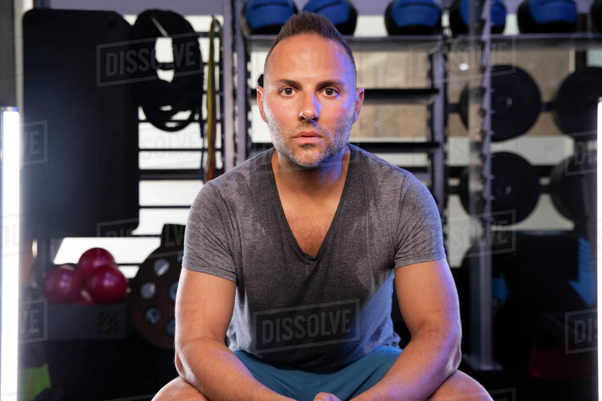 Straight on portrait of a man sweating looking into camera with a ...