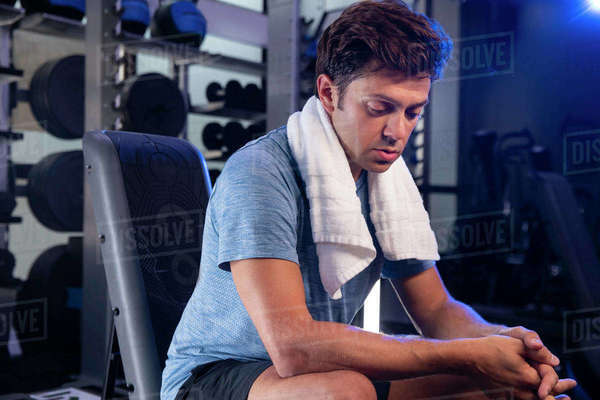 Young man cooling off after working out in gym. - Royalty-free Stock ...