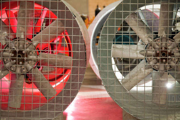 Close up of industrial fans behind metal grate - Royalty-free Stock ...