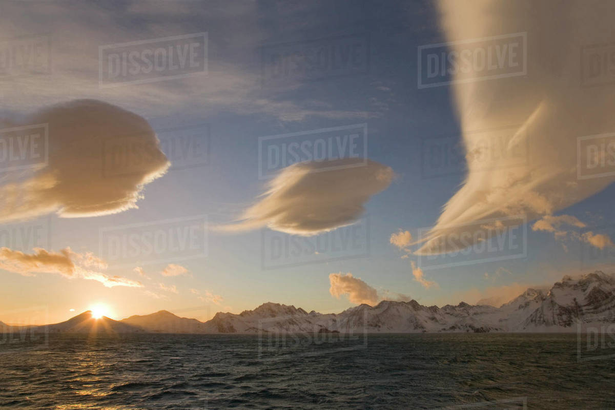 Clouds over the sea at sunrise, Royal Bay, South Georgia Island, South ...