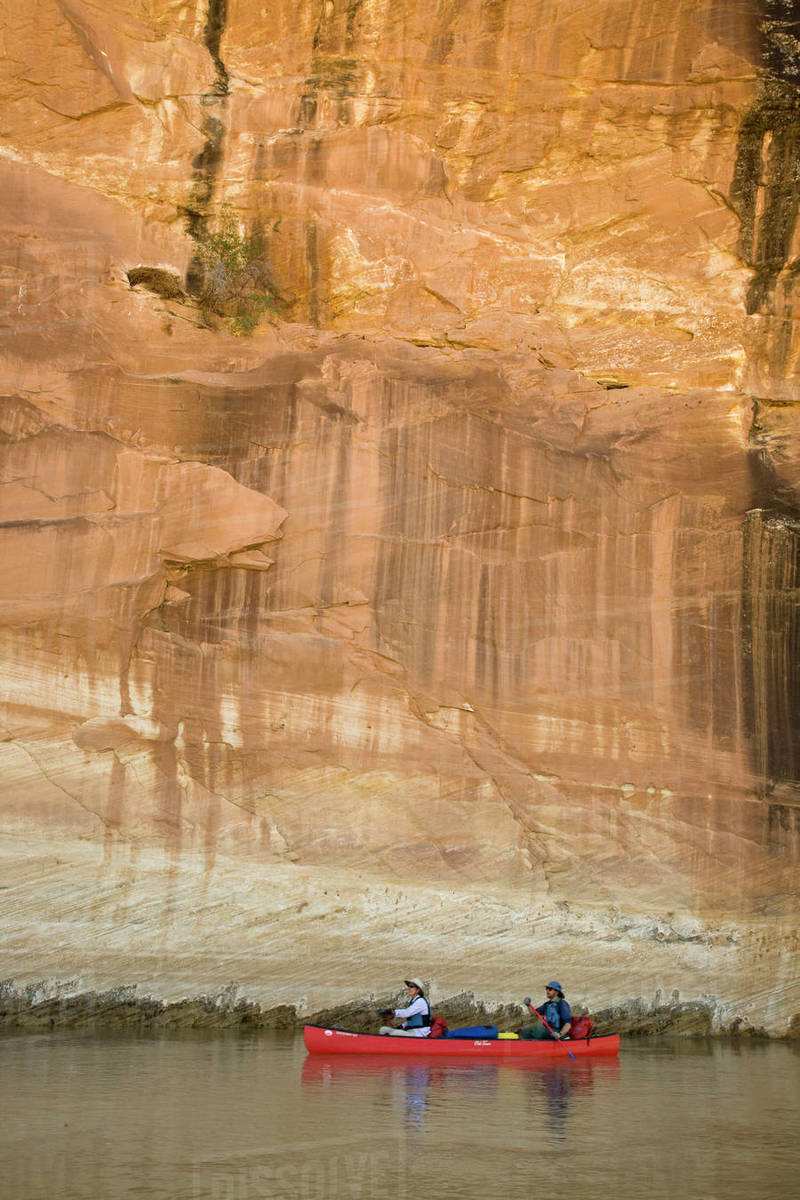 Couple canoeing in a river, Green River, Canyonlands National Park ...