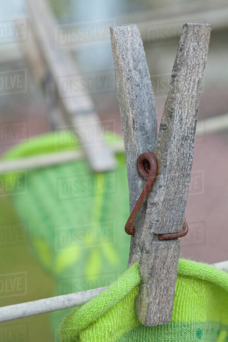 Old wooden clothes pin on clothes line, close-up - Royalty-free Stock ...