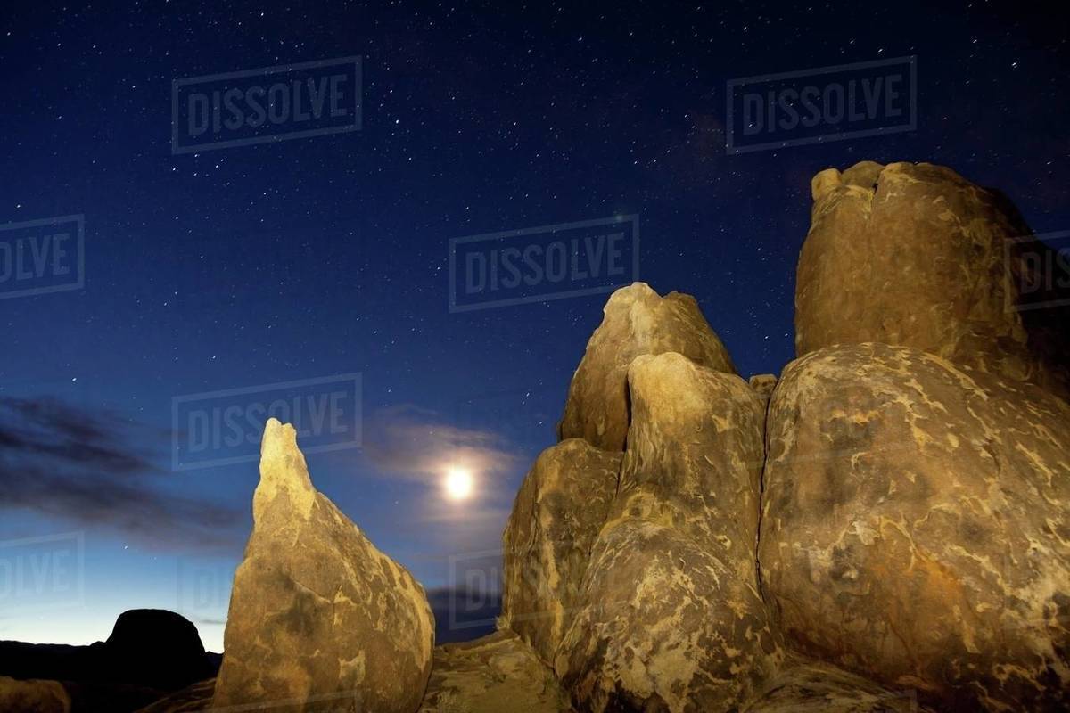 USA, California, Predawn sky with moon, Alabama Hills, near Lone Pine ...