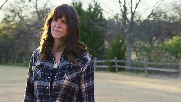 Close up of a woman standing outside, turning to camera. - Stock Video ...